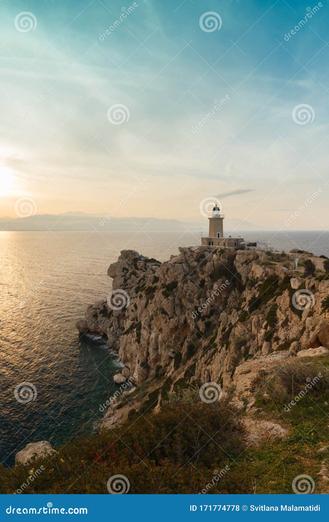 Lighthouse on the cliff stock photo. Image of sunset - 171774778