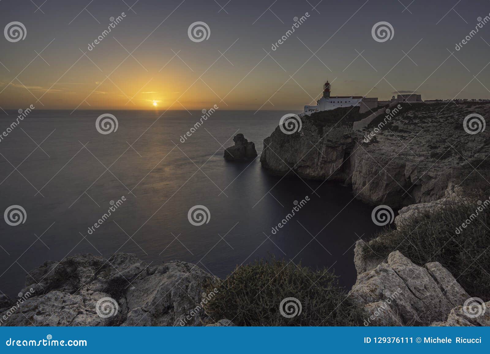 Lighthouse cliff sunset stock image. Image of cliff - 129376111