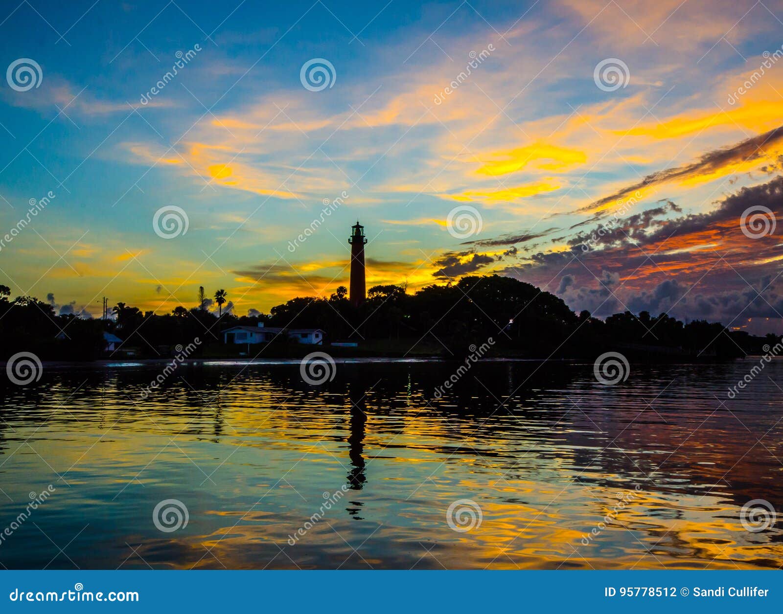 Lighthouse at Dawn stock photo. Image of clouds, orange - 95778512