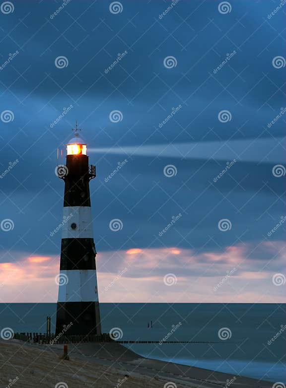 Lighthouse in the dusk stock photo. Image of hope, compass - 1199538