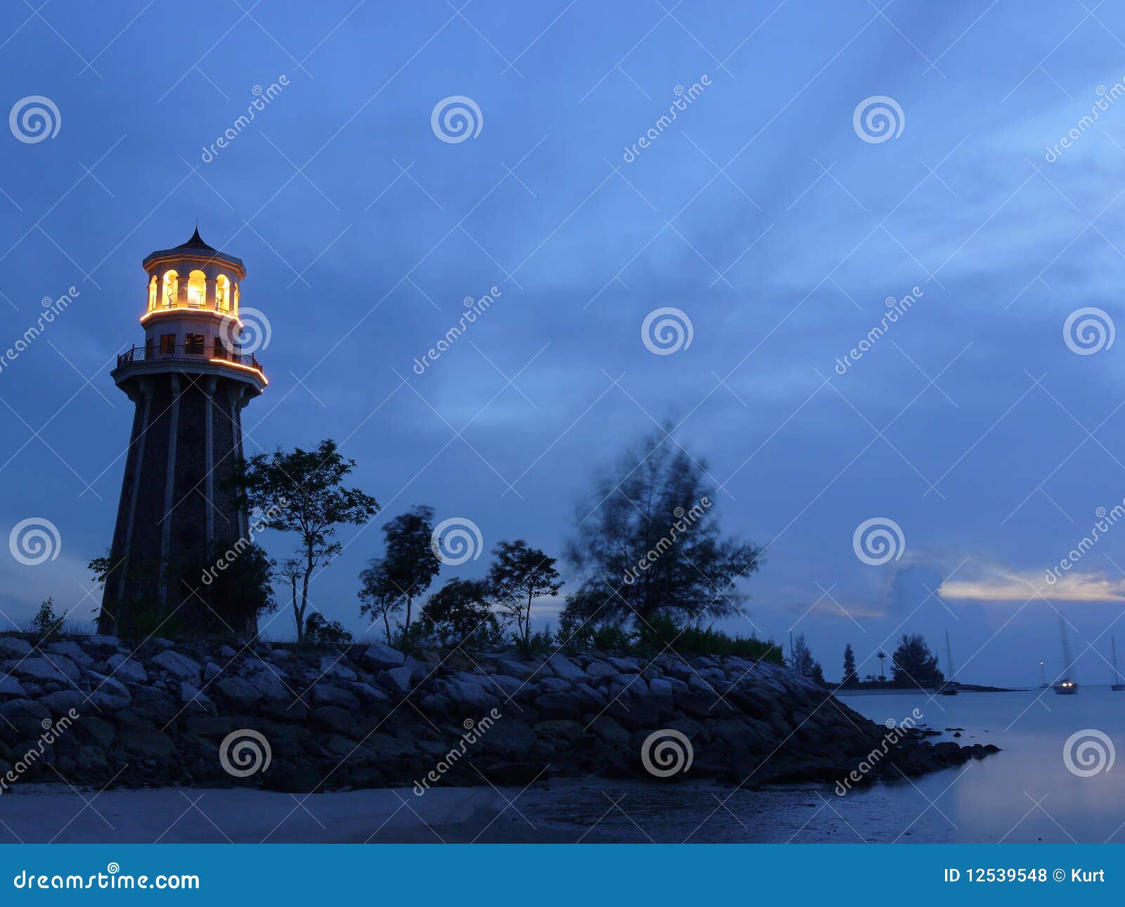Lighthouse at dusk stock photo. Image of navigation, guide - 12539548