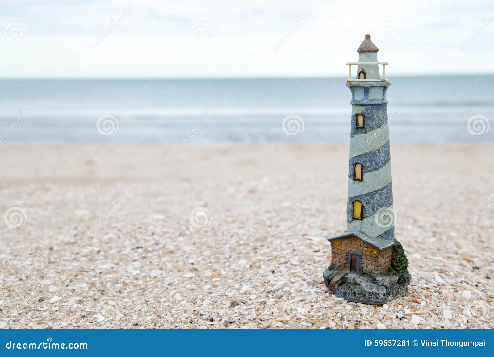 Lighthouse Figure on the Beach in the Evening Stock Image - Image of ...