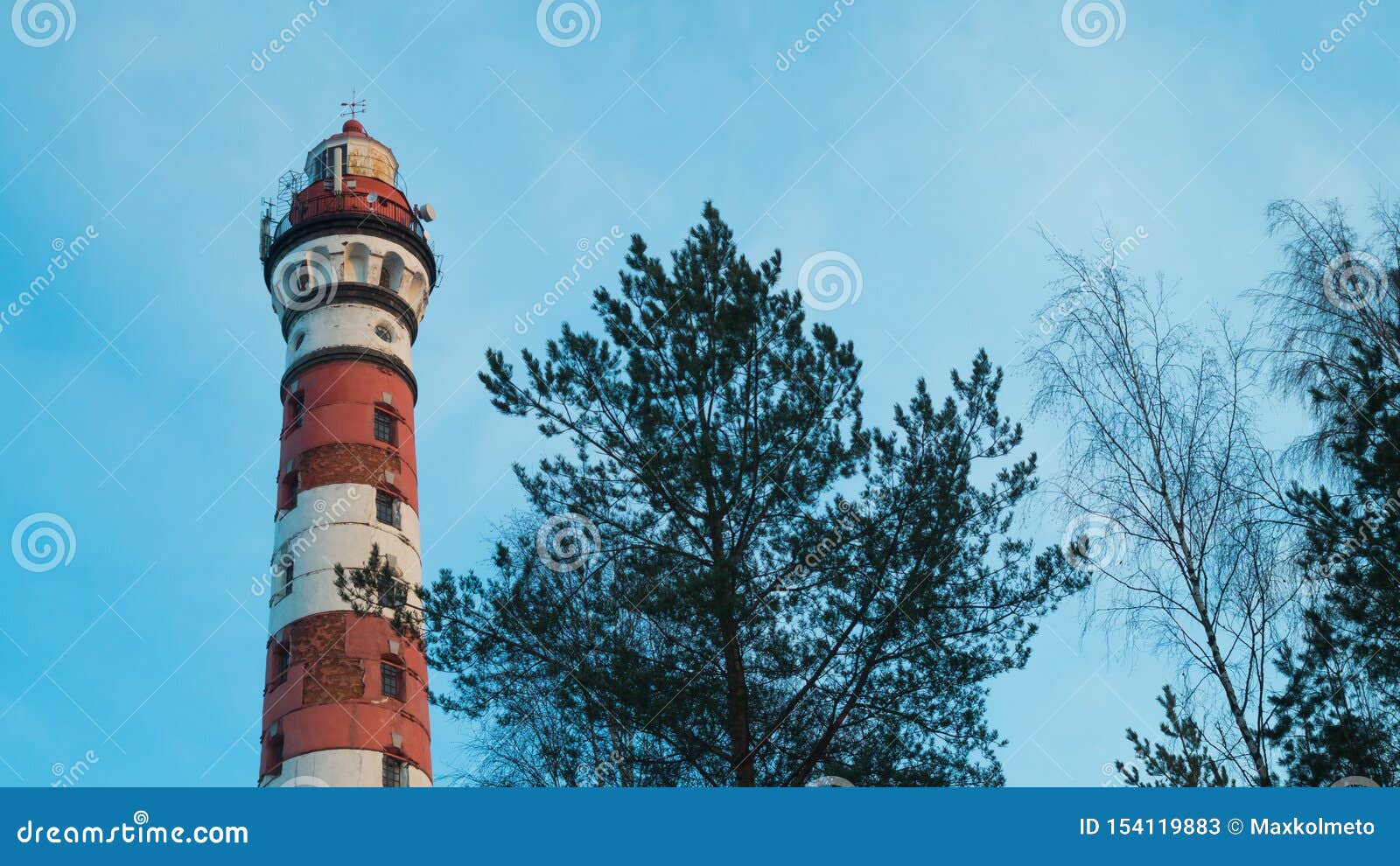 Lighthouse in the Forest among the Trees. Red and White Lighthouse ...