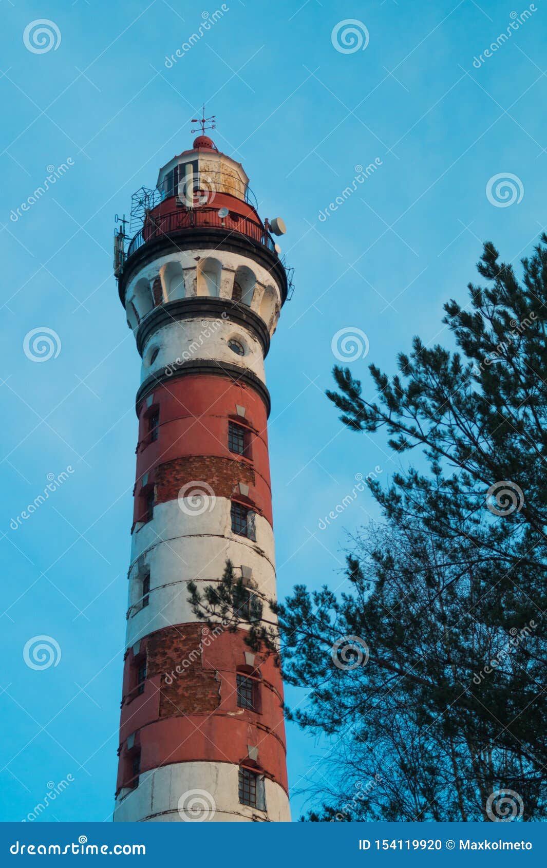 Lighthouse in the Forest among the Trees. Red and White Lighthouse ...