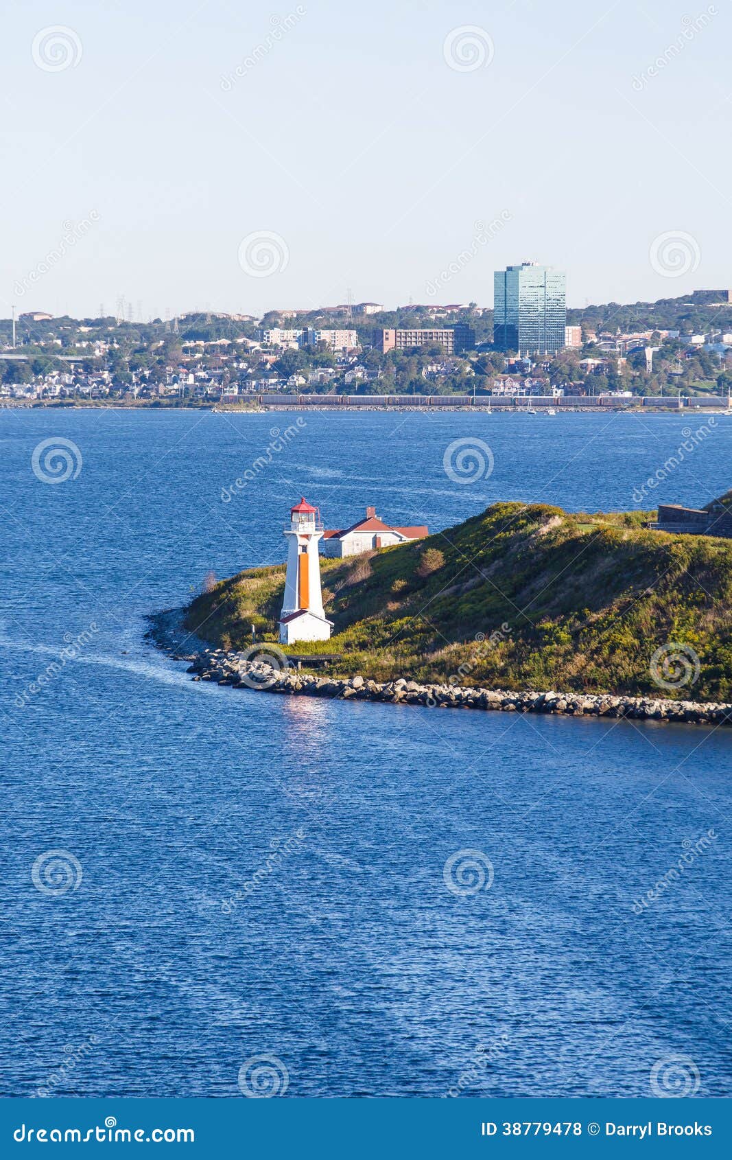 Lighthouse on Green Point Over Blue Water Stock Photo - Image of tower ...