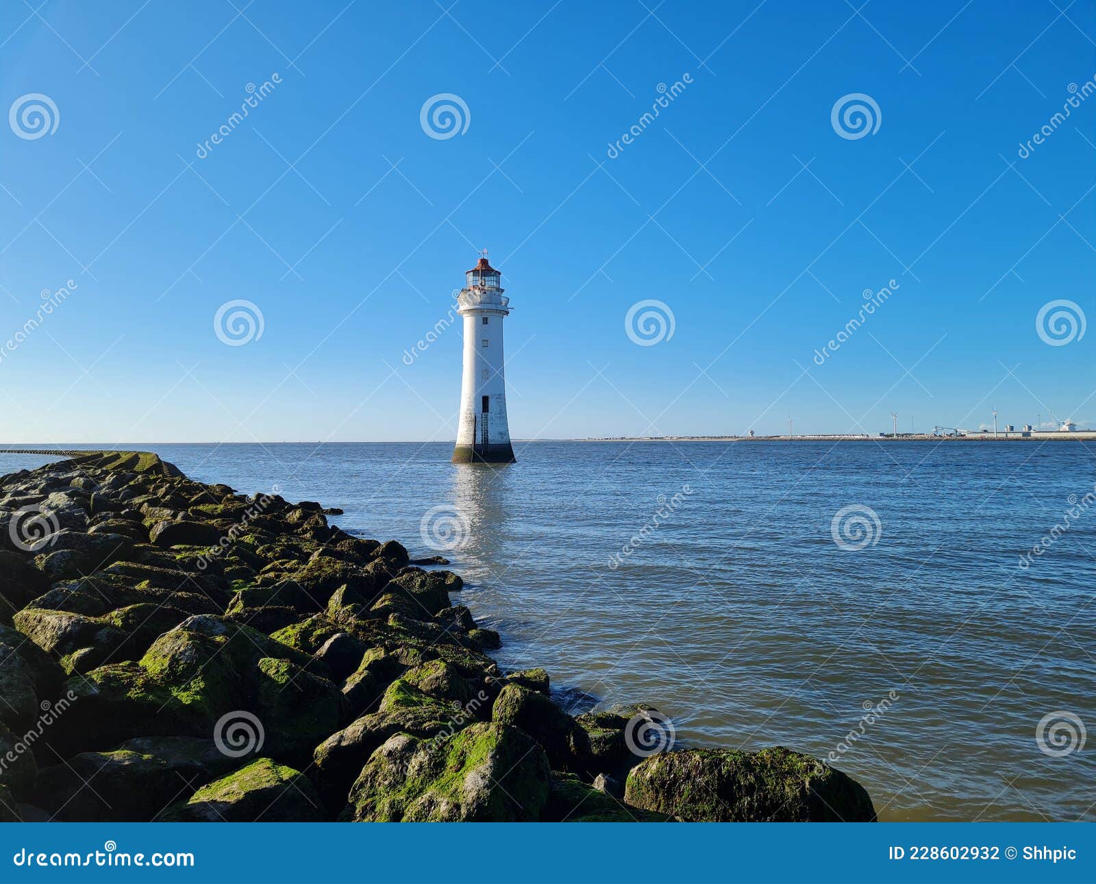 Lighthouse in high tide stock photo. Image of breakwater - 228602932