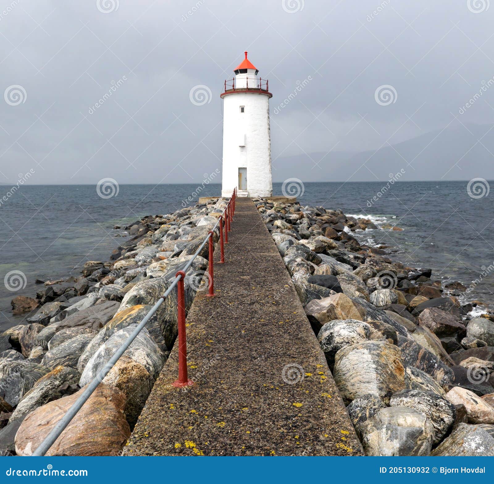 Lighthouse and jetty stock photo. Image of security - 205130932