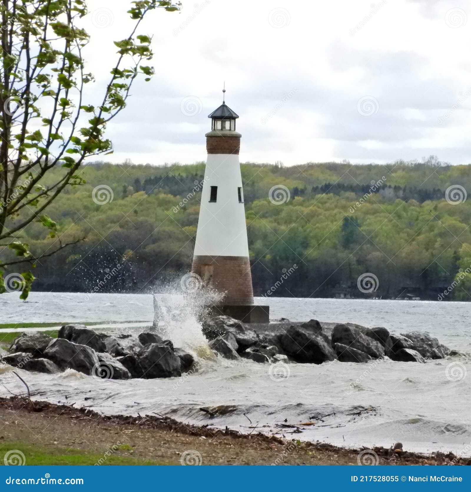Lake Lighthouse and Lake Waves Break on Rocky Pier Stock Image - Image ...