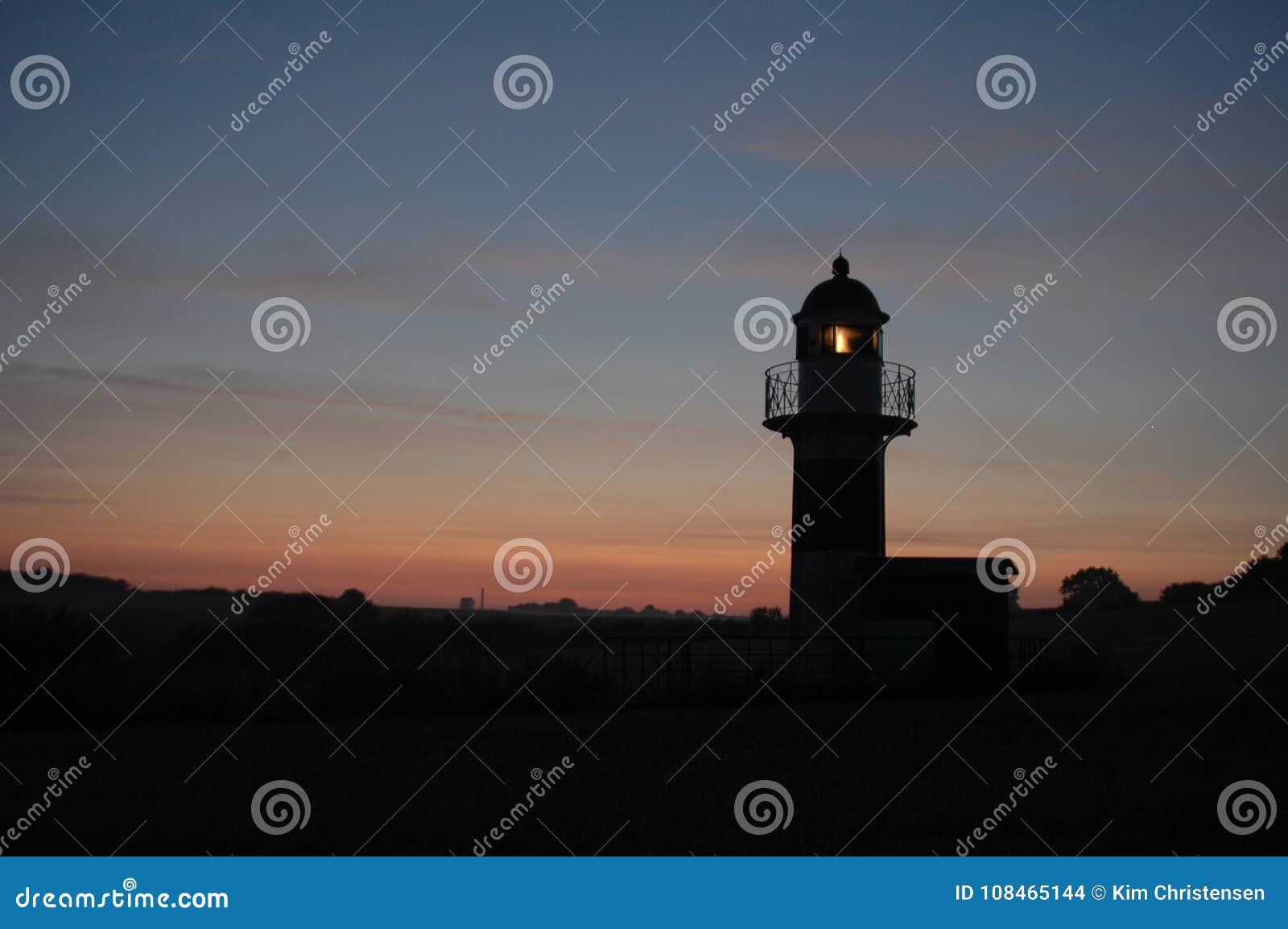 Lighthouse with Light at Dawn Stock Photo - Image of building ...