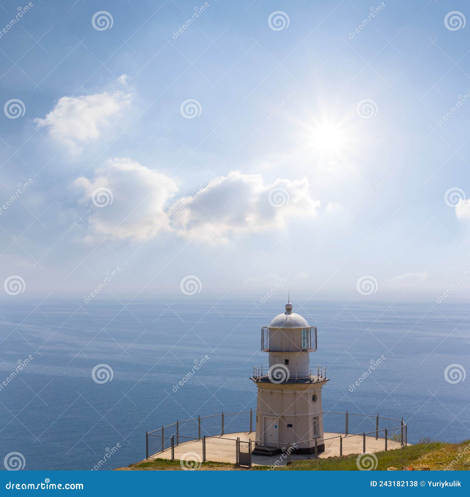 Lighthouse on marine cape stock photo. Image of sunbeam - 243182138