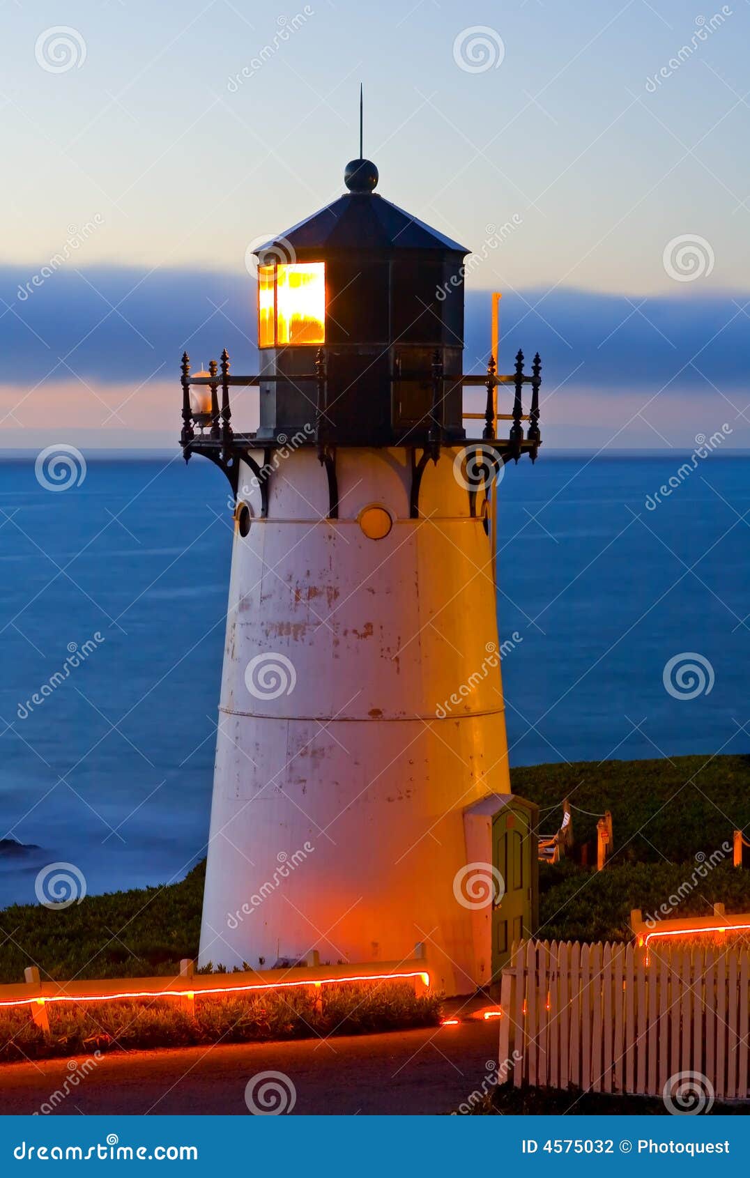 Lighthouse at night stock photo. Image of orange, historic - 4575032