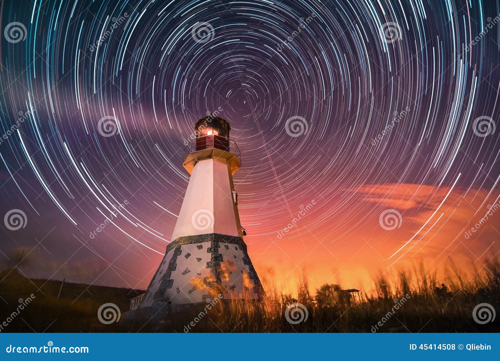 Lighthouse with Night Sky at Background Stars Trails Stock Photo ...