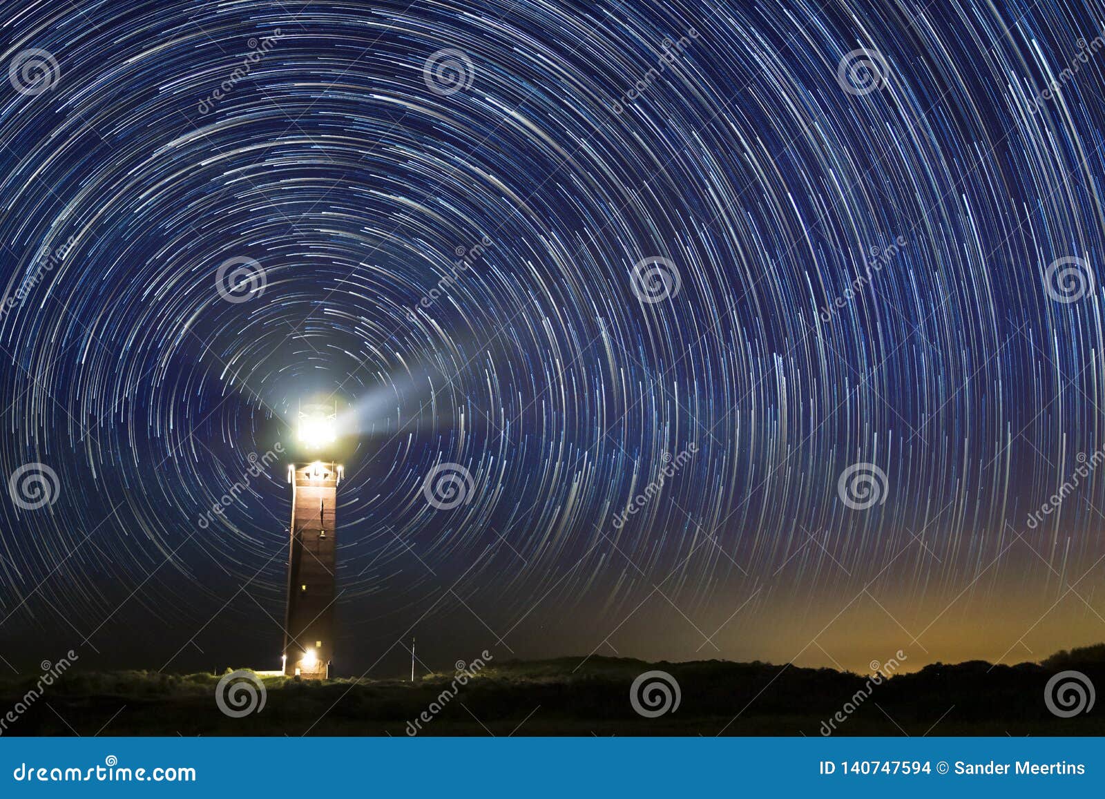 Lighthouse at Night with Star Trails at the Center Stock Photo - Image ...