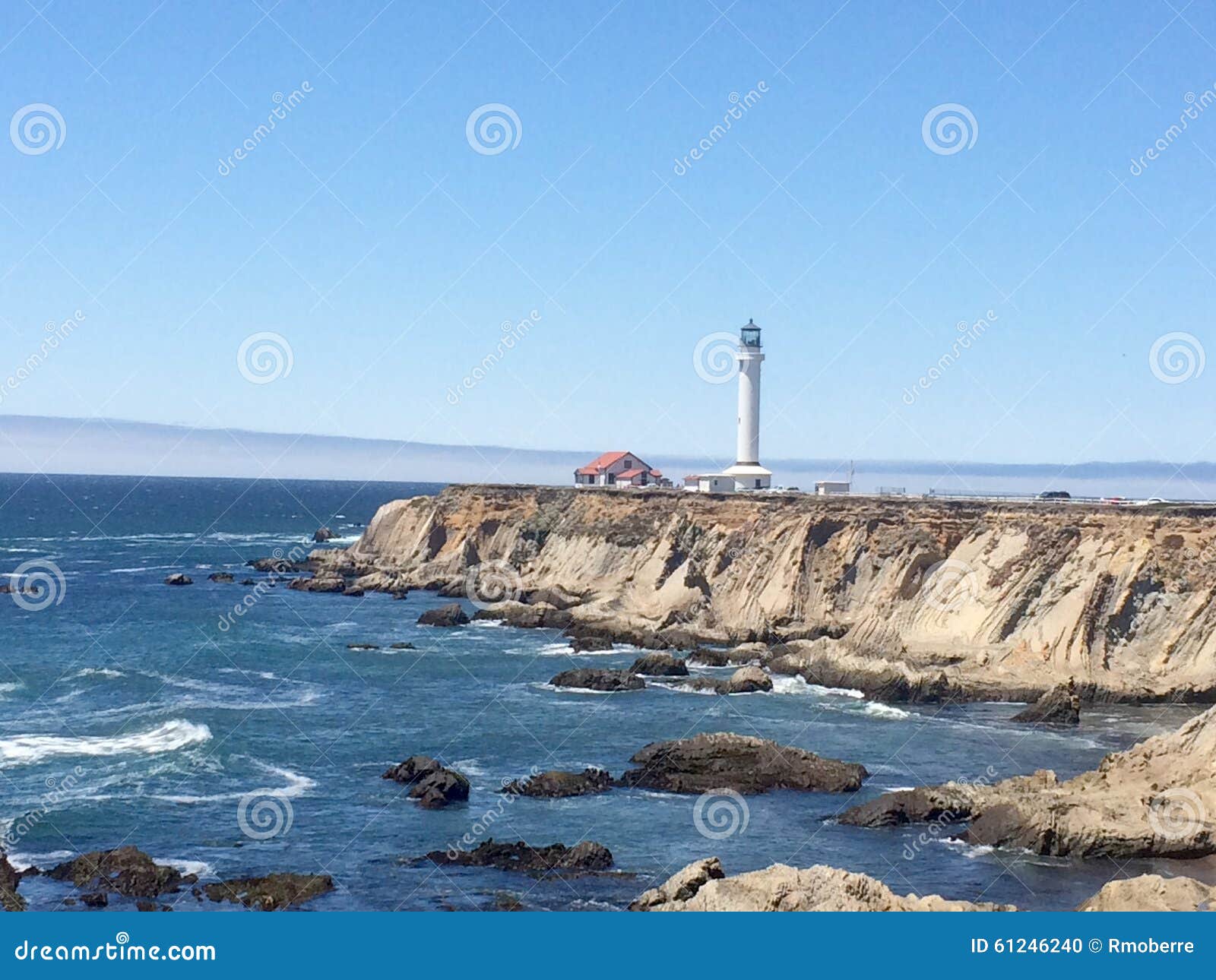 Lighthouse on Ocean Cliff stock photo. Image of ocean - 61246240