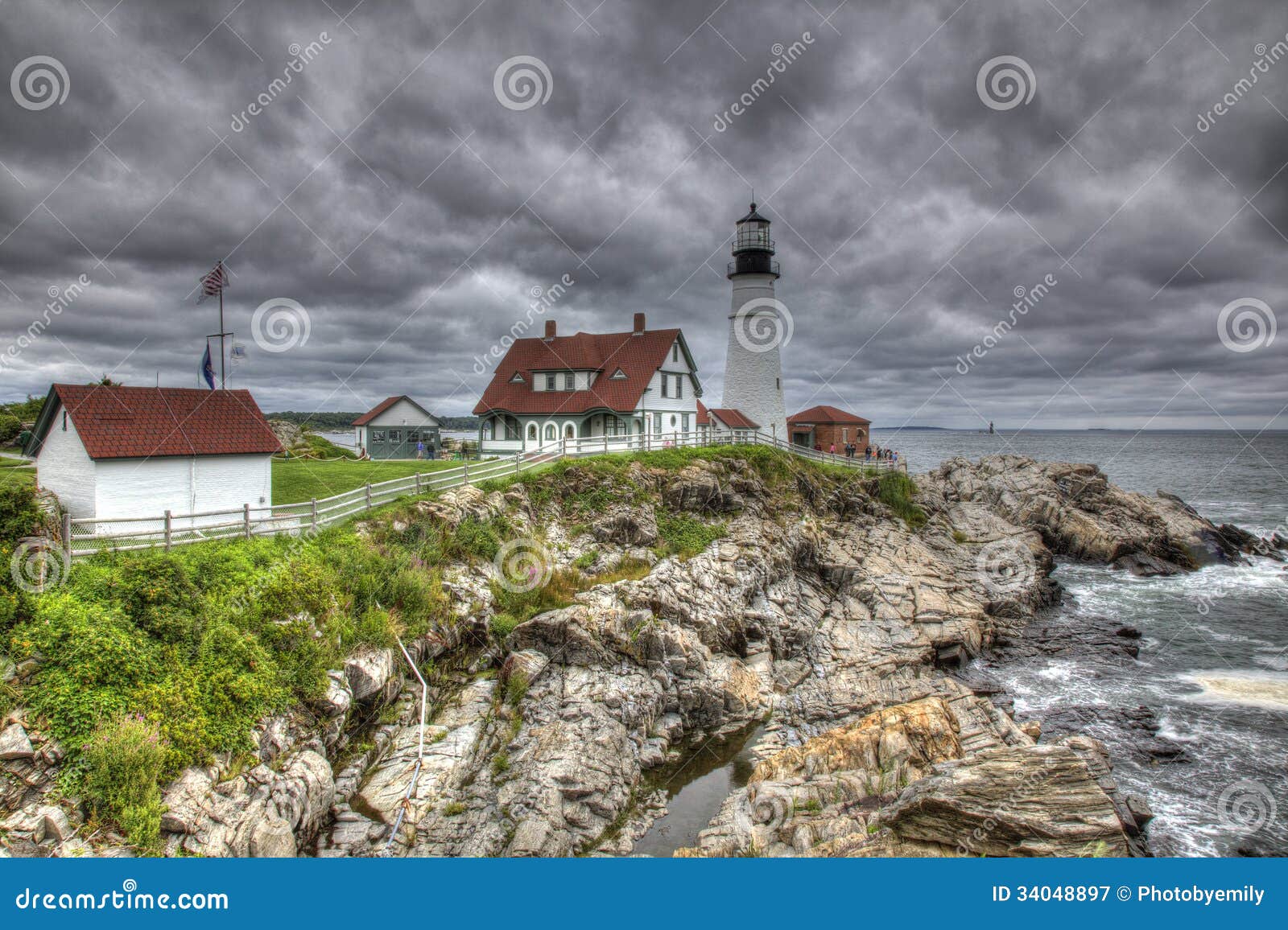 Lighthouse by Ocean on Rocks Stock Image - Image of coastline, building ...
