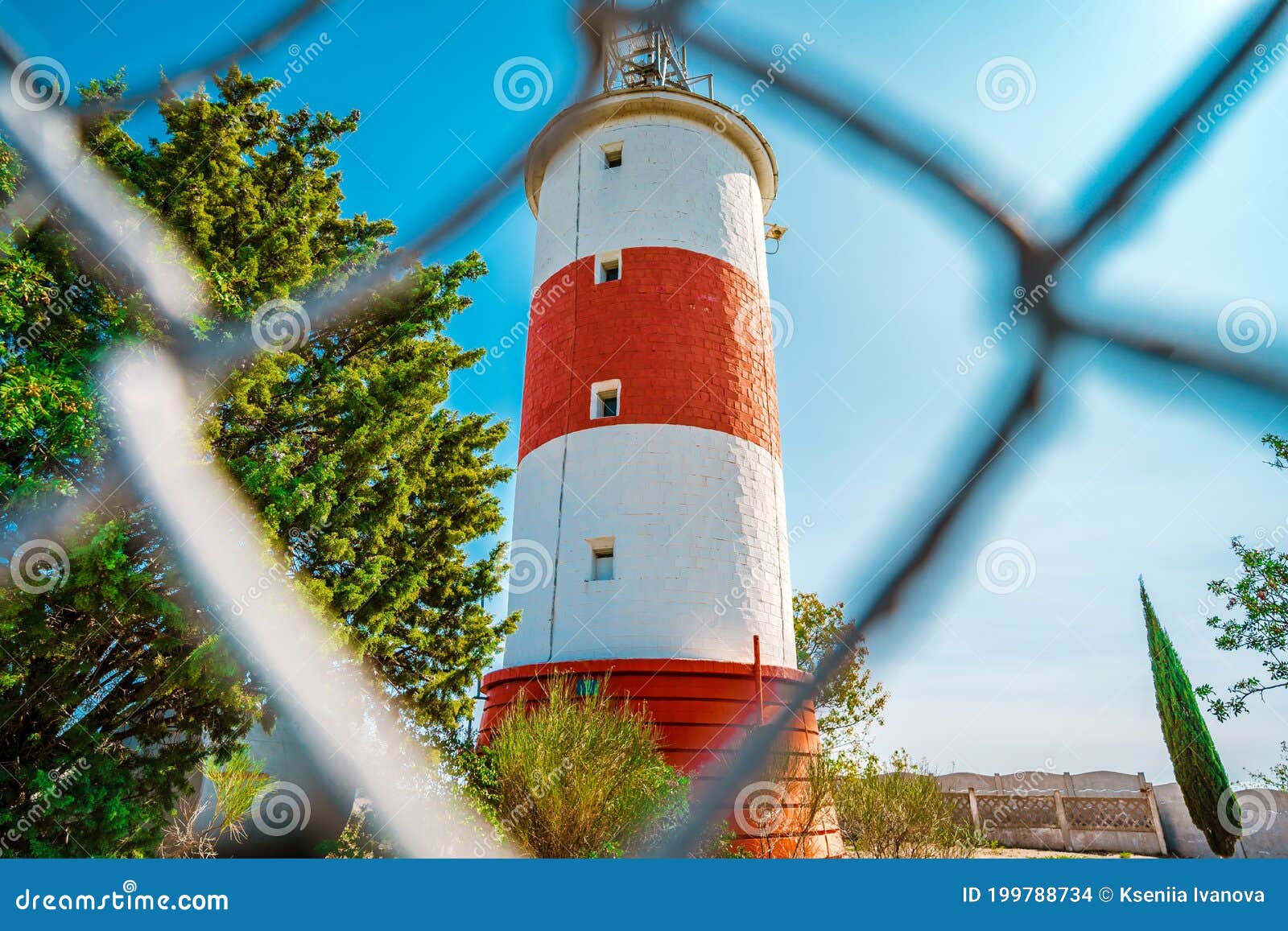 Lighthouse with Red Stripes on a Background of Blue Sky, Beautiful ...