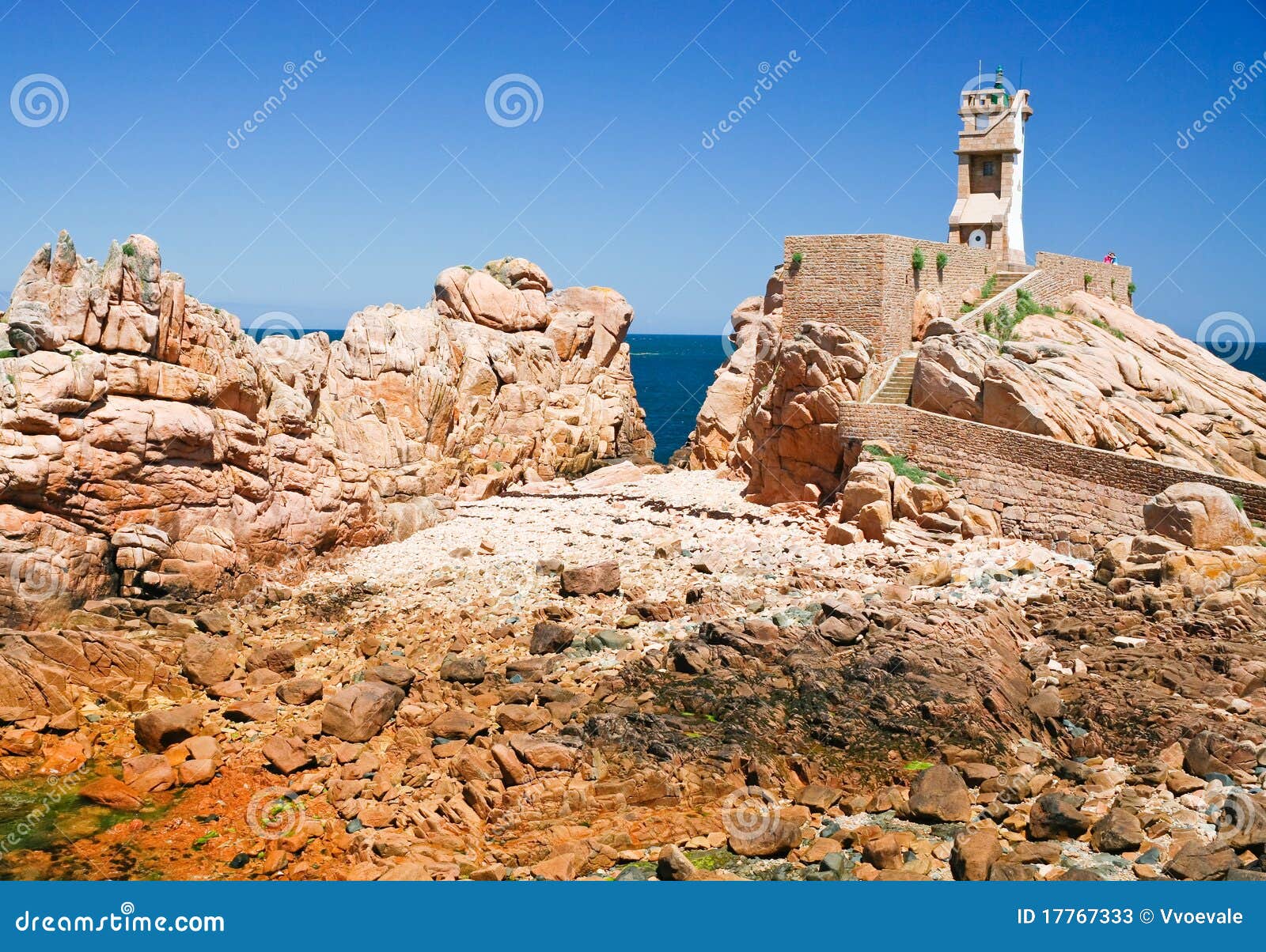 Lighthouse in the rocks stock image. Image of island - 17767333