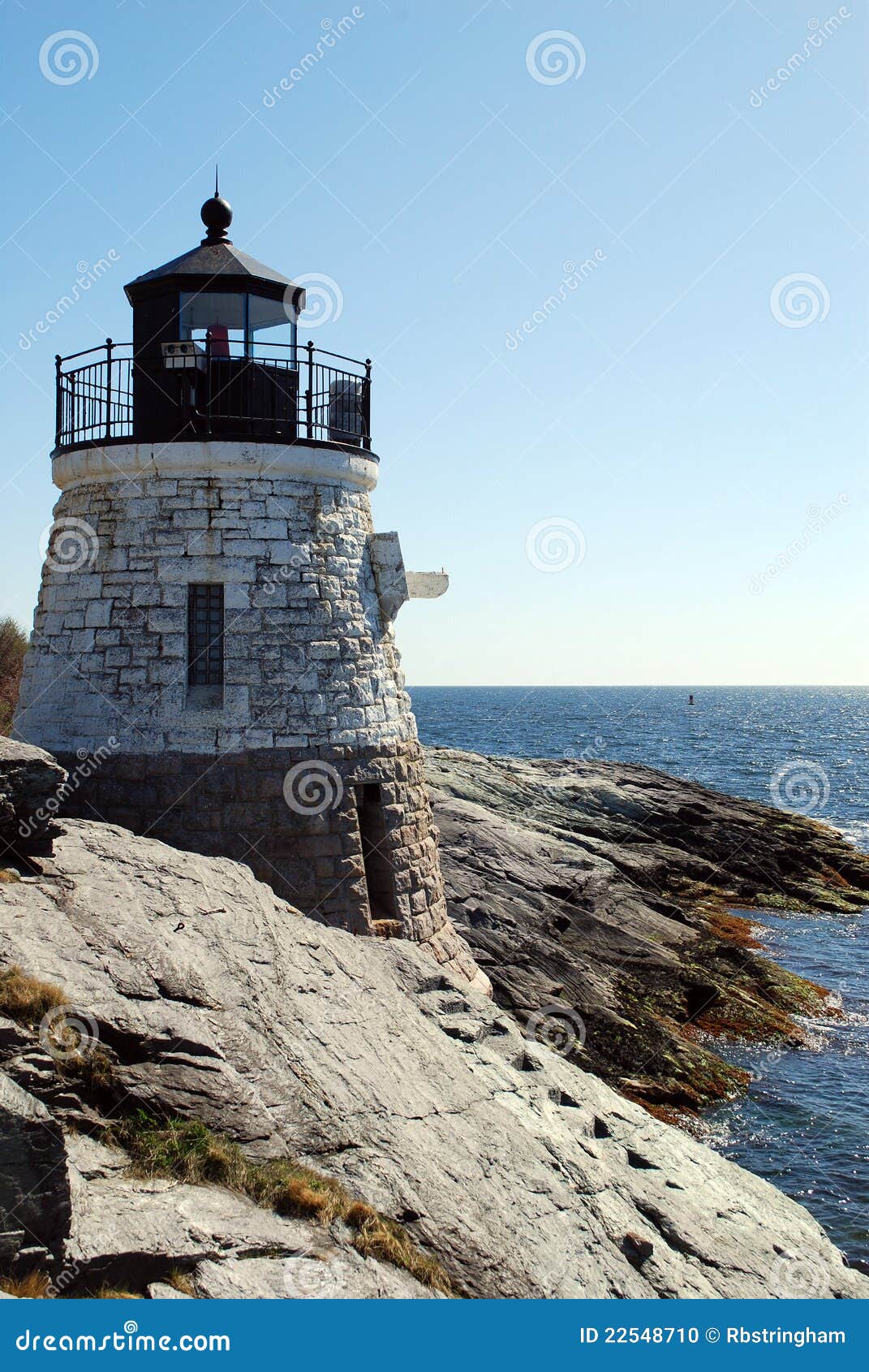 A Lighthouse on the Rocks stock photo. Image of rock - 22548710