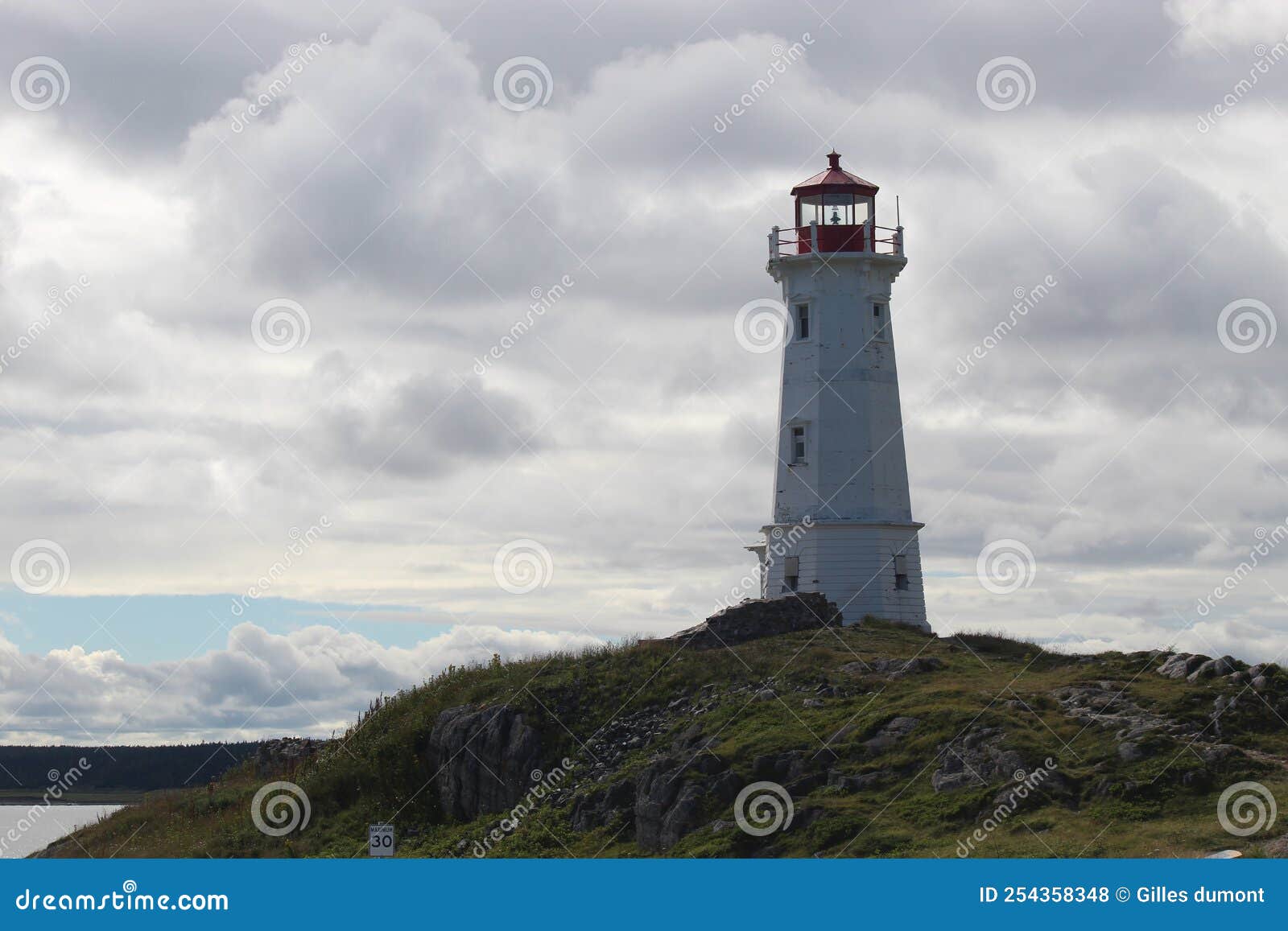Lighthouse on rocks stock photo. Image of rock, rocks - 254358348