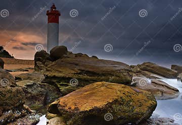 Lighthouse on Rocks stock image. Image of coastline, horizon - 9178605