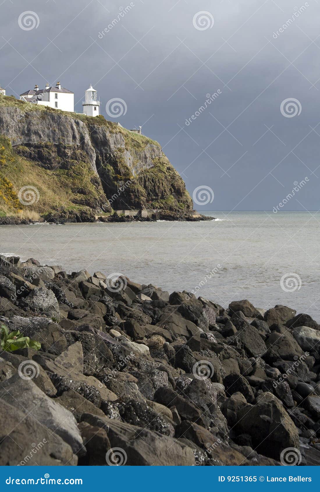 Lighthouse and rocks stock image. Image of whitehead, lighthouse - 9251365