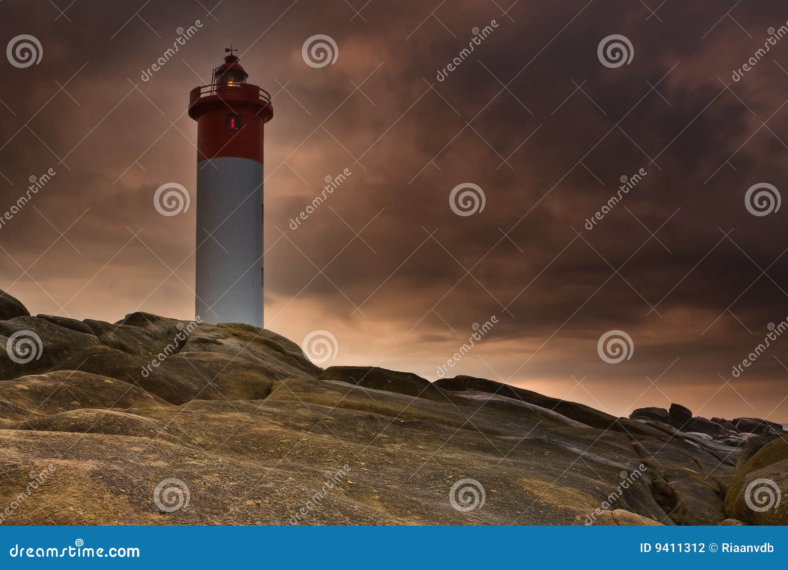 Lighthouse On Rocks Picture. Image: 9411312