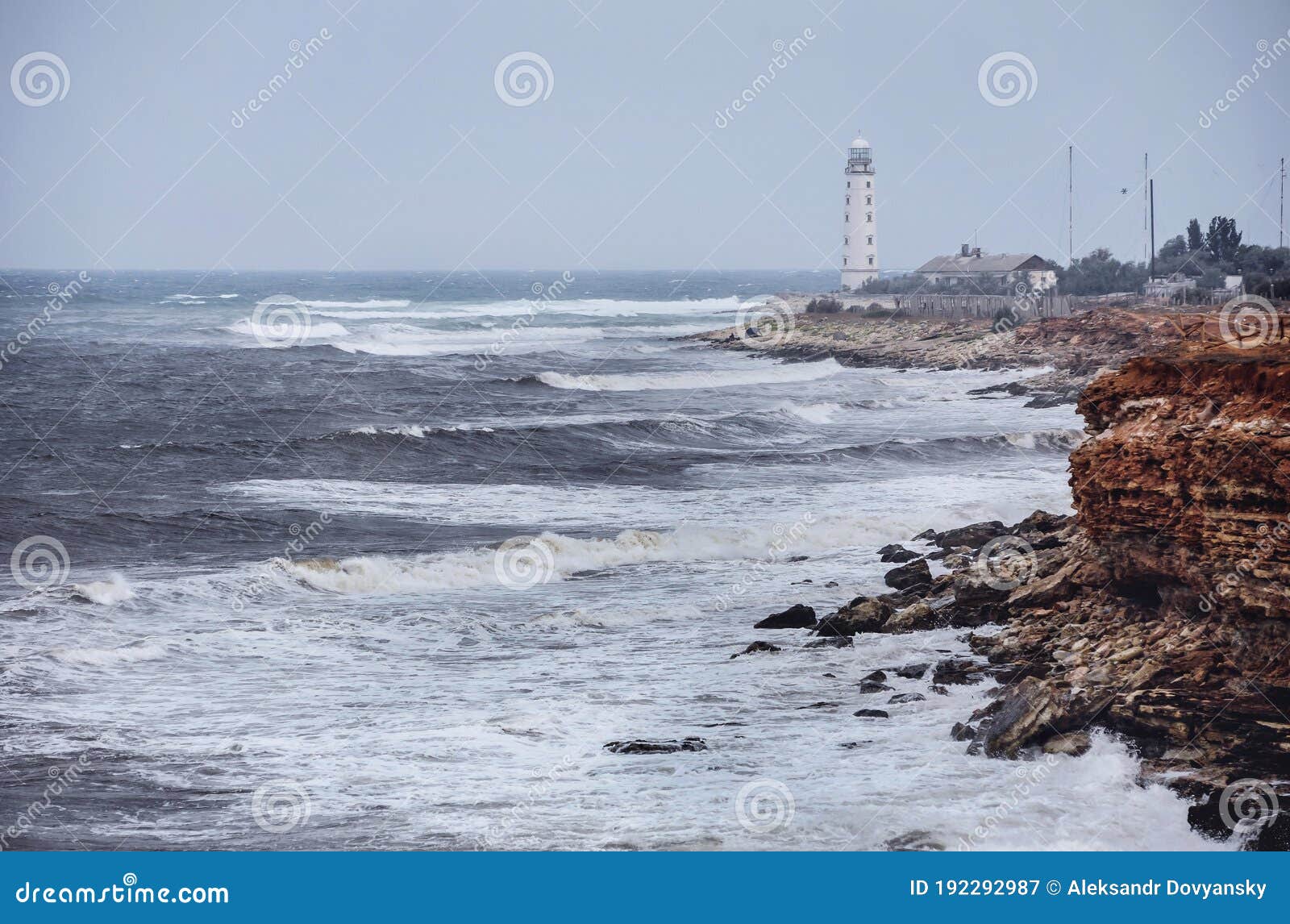 Lighthouse on the Rocky Seashore during Storm and Bad Weather Stock ...