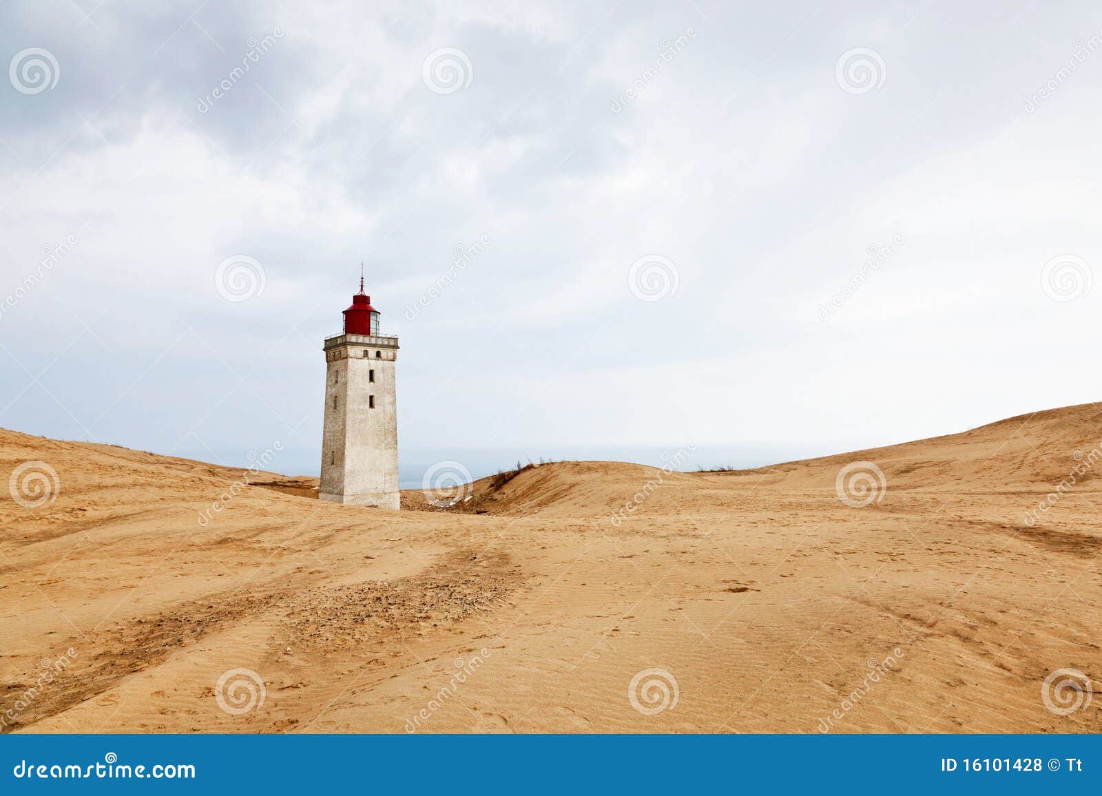 Lighthouse and sand dune stock photo. Image of building - 16101428