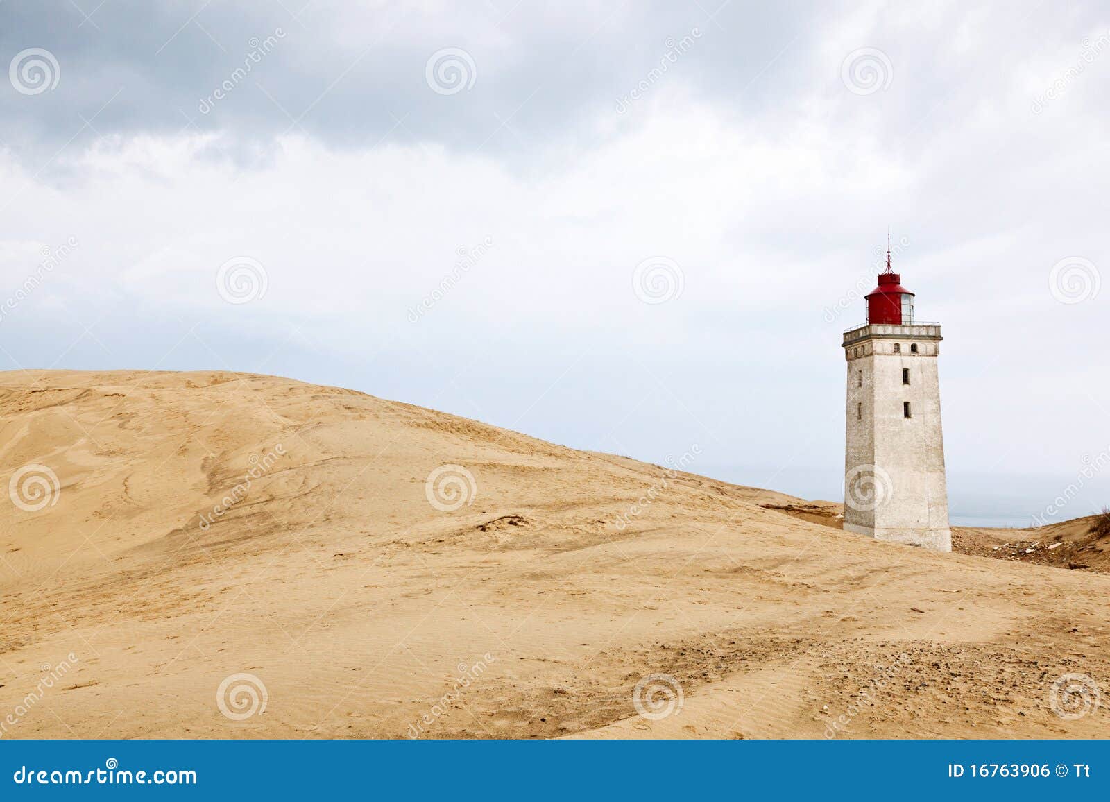 Lighthouse and sand dune stock photo. Image of land, sand - 16763906