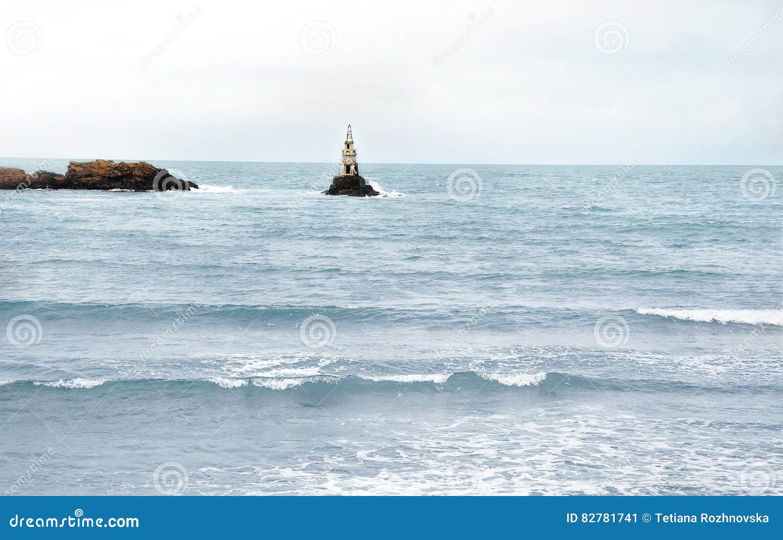 Lighthouse in the sea. stock image. Image of lookout - 82781741