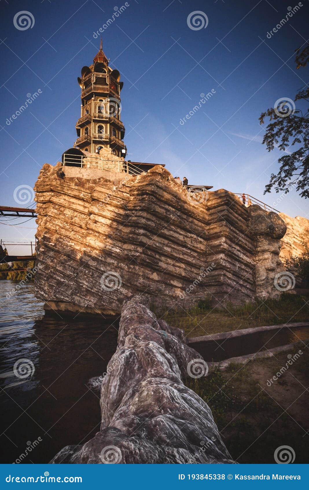 A Lighthouse in the Setting Sun. a Lighthouse and an Abandoned Ship in ...