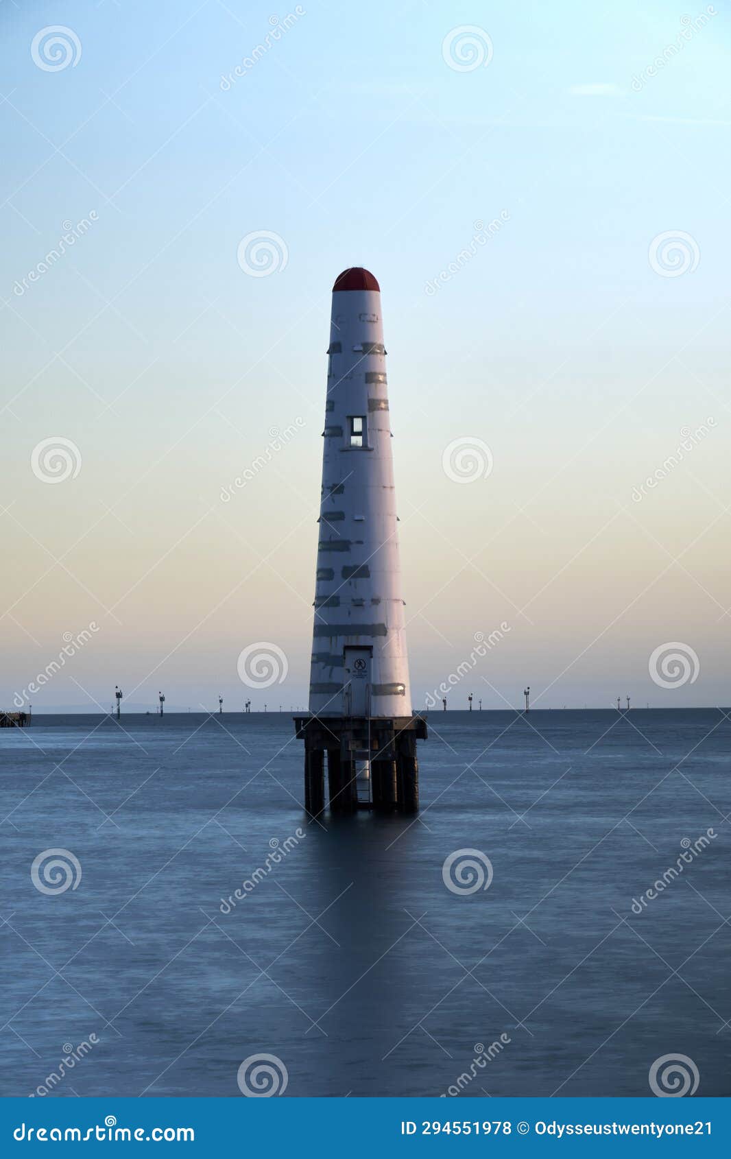 A Lighthouse Shaped Building Stock Photo - Image of blue, ocean: 294551978