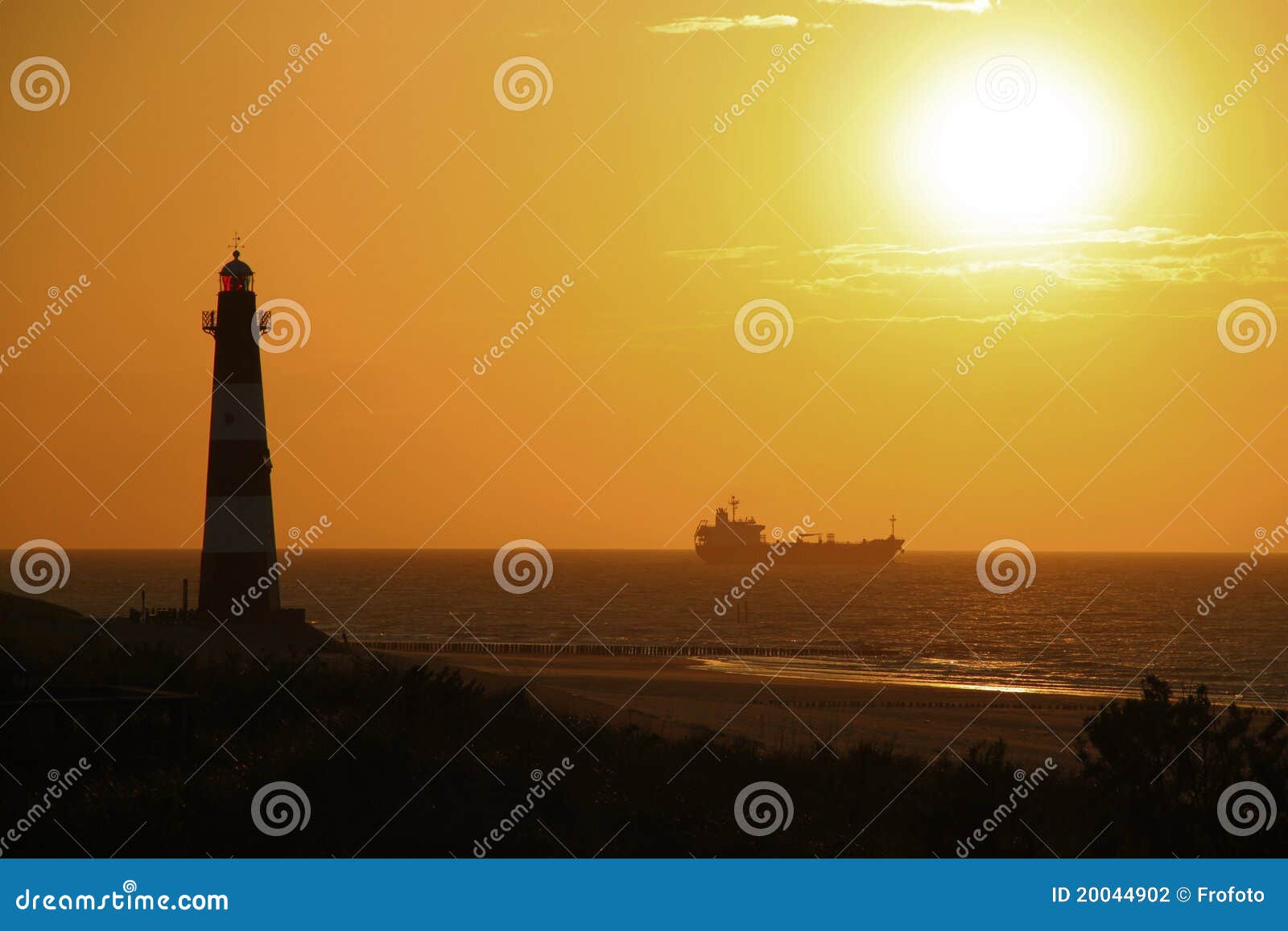 Lighthouse and ship stock photo. Image of horizon, sunbeam - 20044902