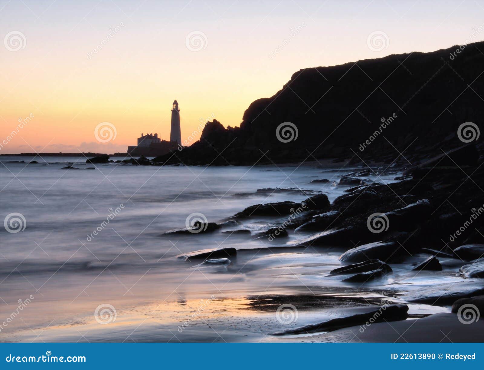Lighthouse on Shore at Sunset Stock Photo - Image of colorful, maritime ...
