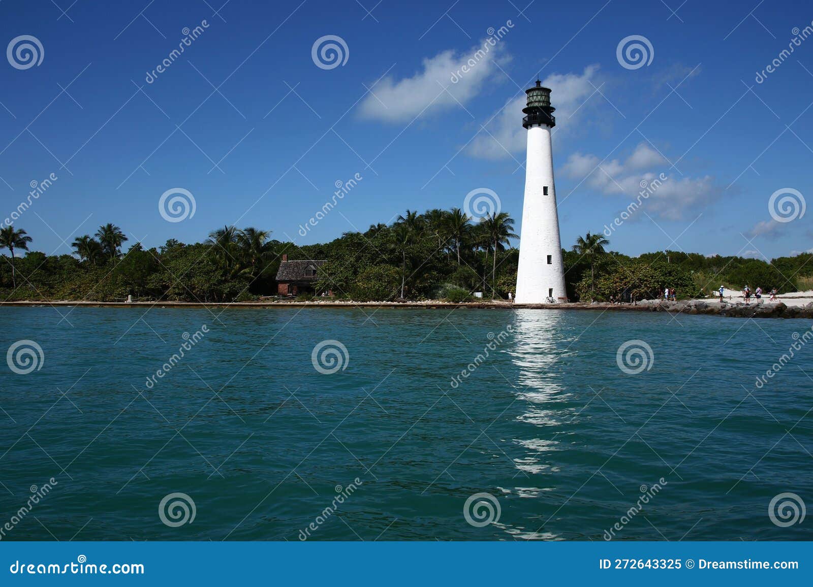 A Lighthouse is Shown in a Lagoon on the Shore of a Tropical Island ...