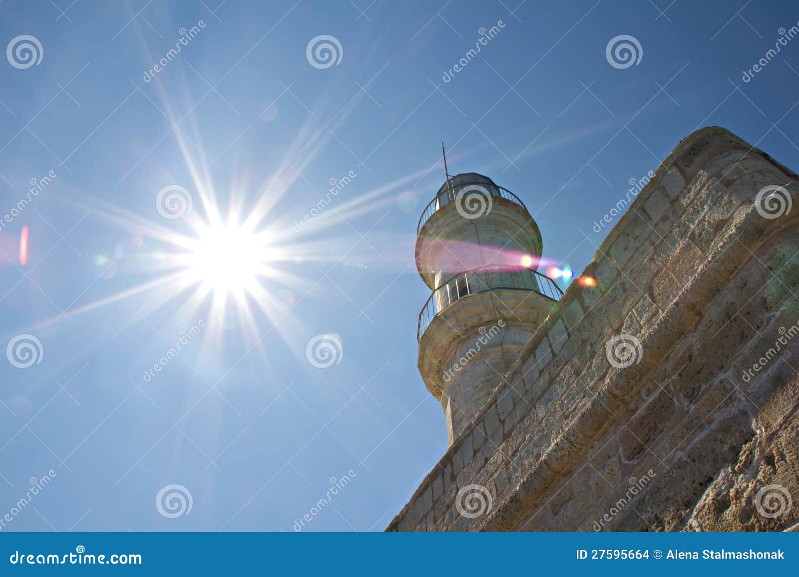 Lighthouse and the sun stock photo. Image of harbor, beautiful - 27595664