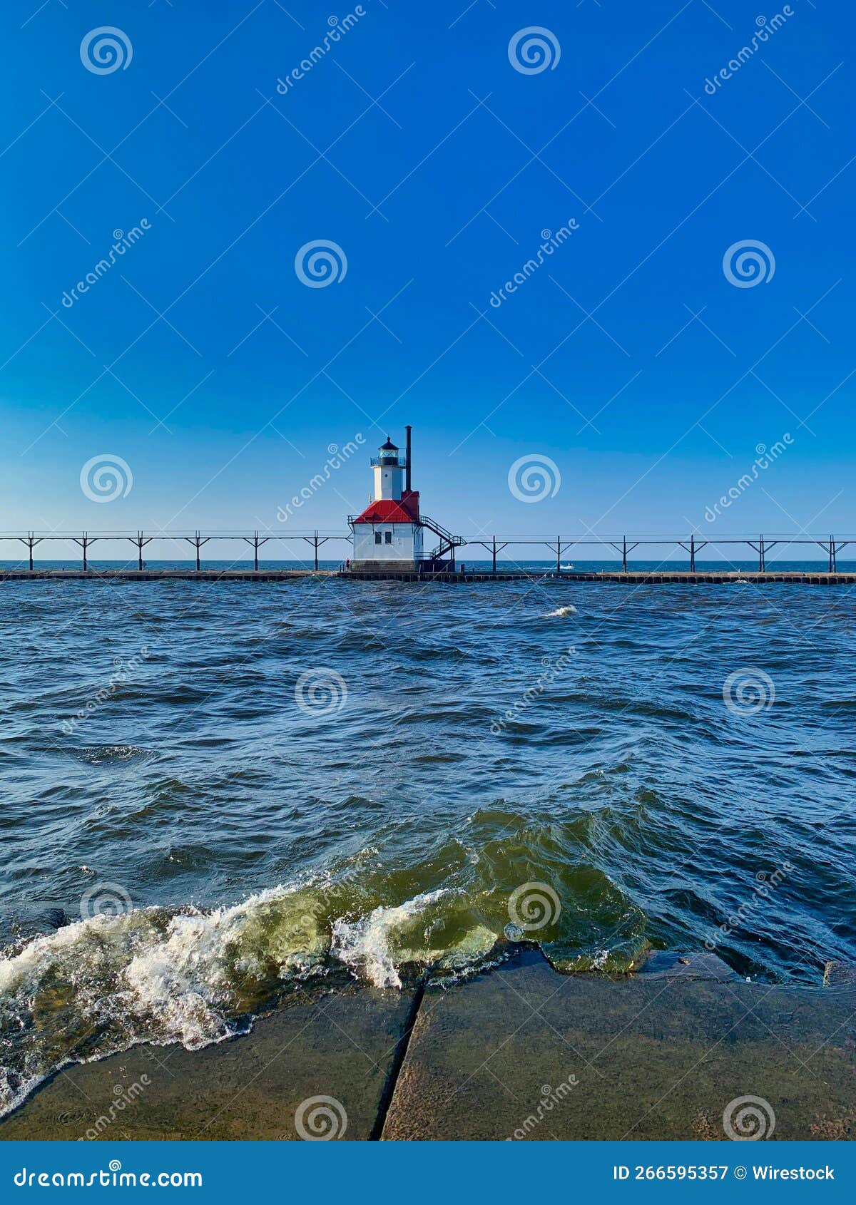 Lighthouse on a Sunny Day, Water Splashing on Pier Stock Image - Image ...