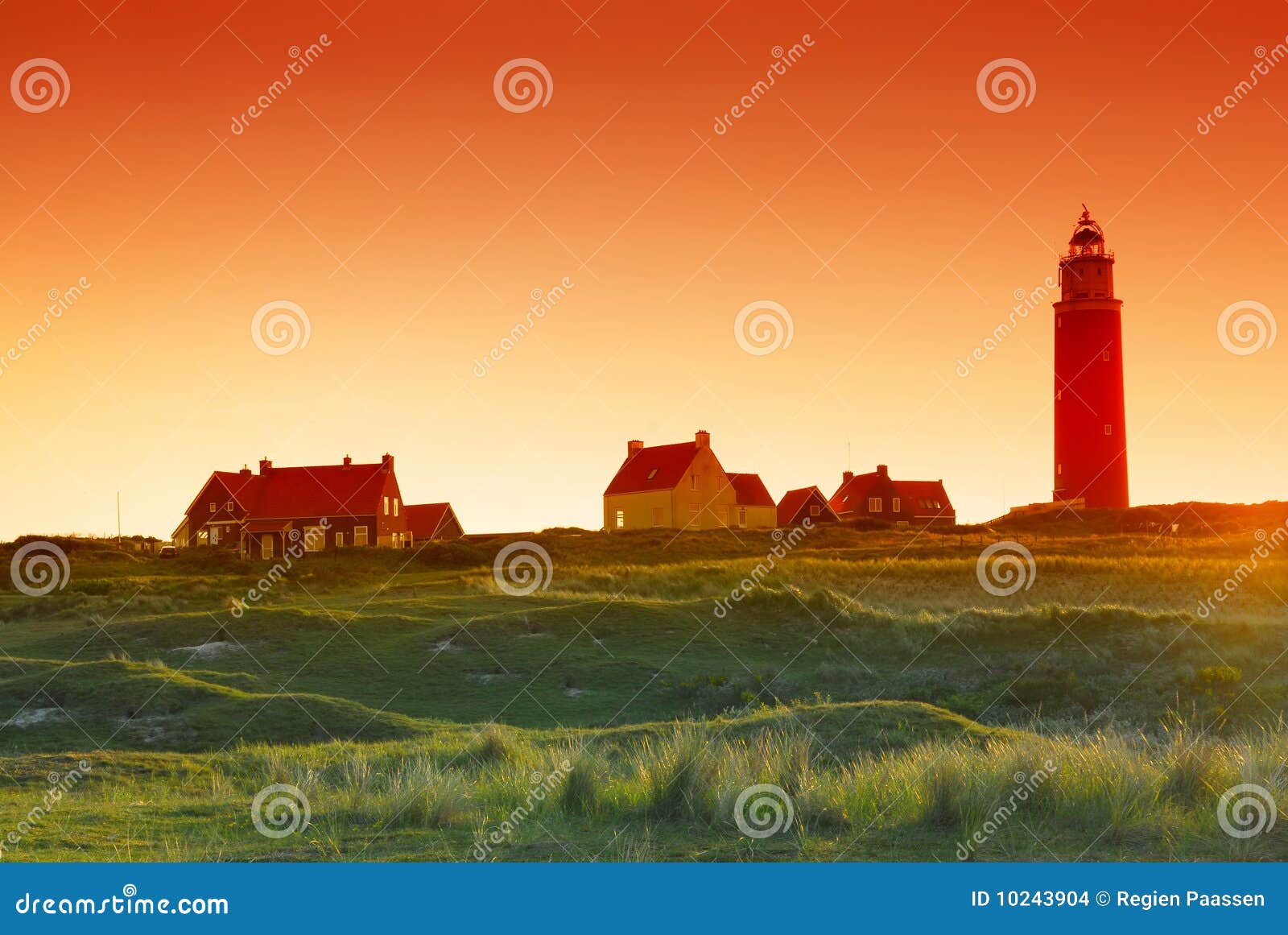 Lighthouse sunrise stock photo. Image of houses, beach - 10243904