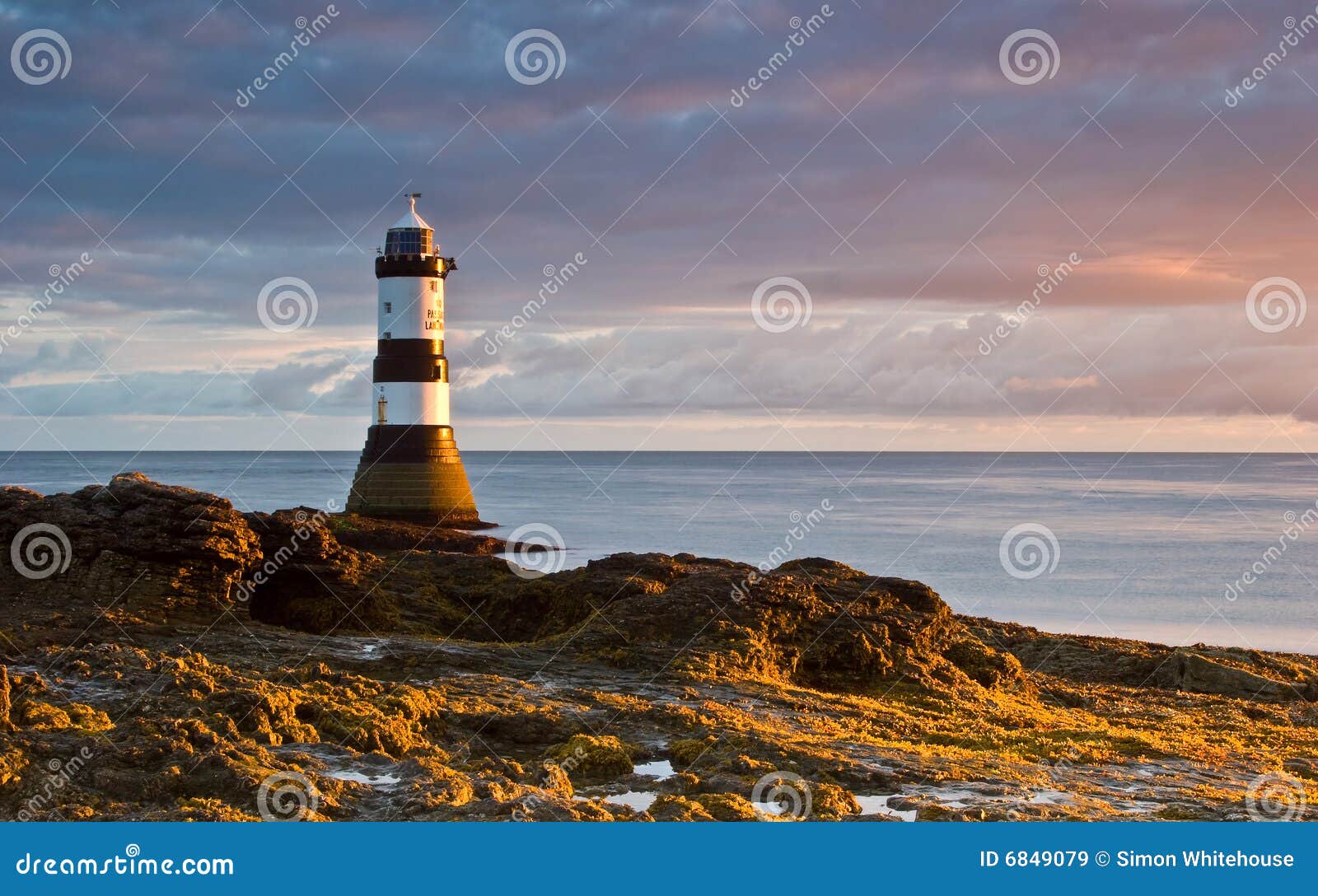 Lighthouse at Sunrise stock image. Image of clouds, horizon - 6849079