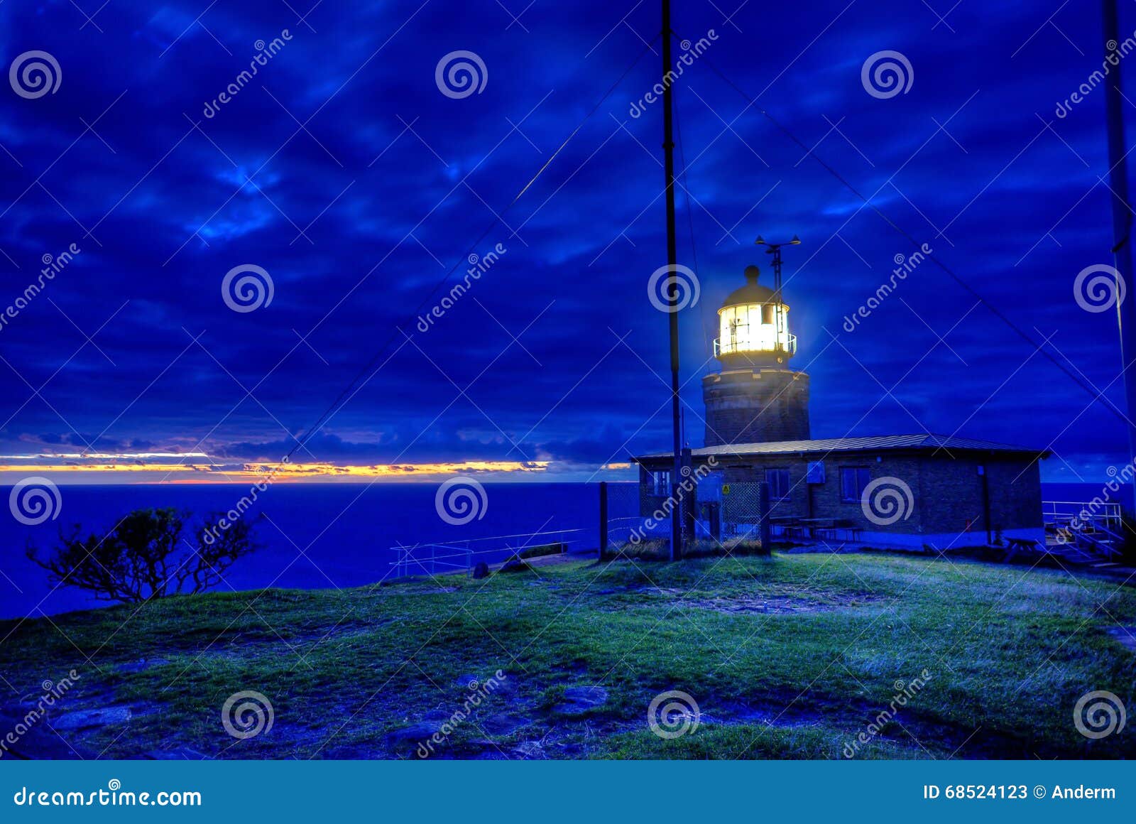 Lighthouse at sunset stock image. Image of beam, dusk - 68524123