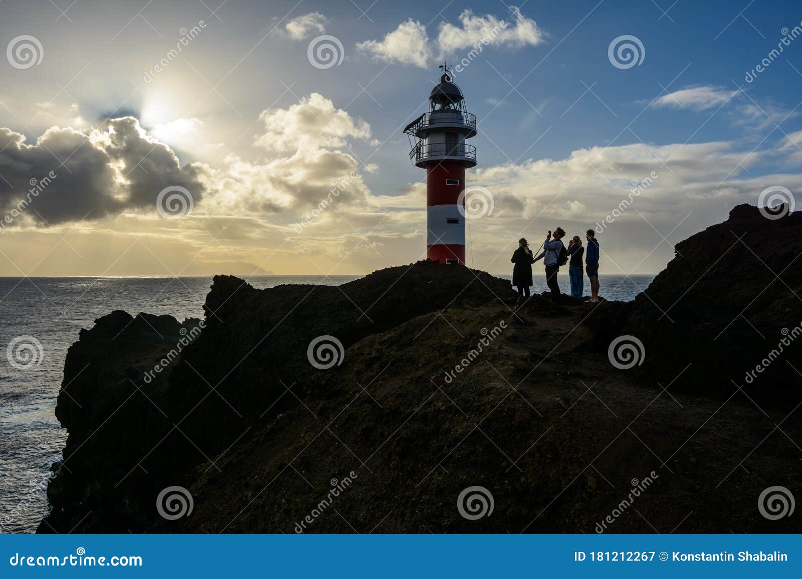 Lighthouse in the Sunset. Lighthouse and People Stock Image - Image of ...