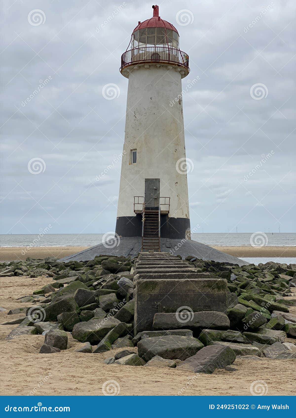 Lighthouse on the Beach Overlooking Ocean Stock Photo - Image of ...