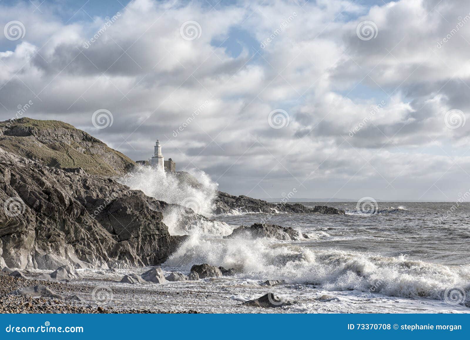 Lighthouse Surrounded by Waves on a Cloudy Day Stock Photo - Image of ...