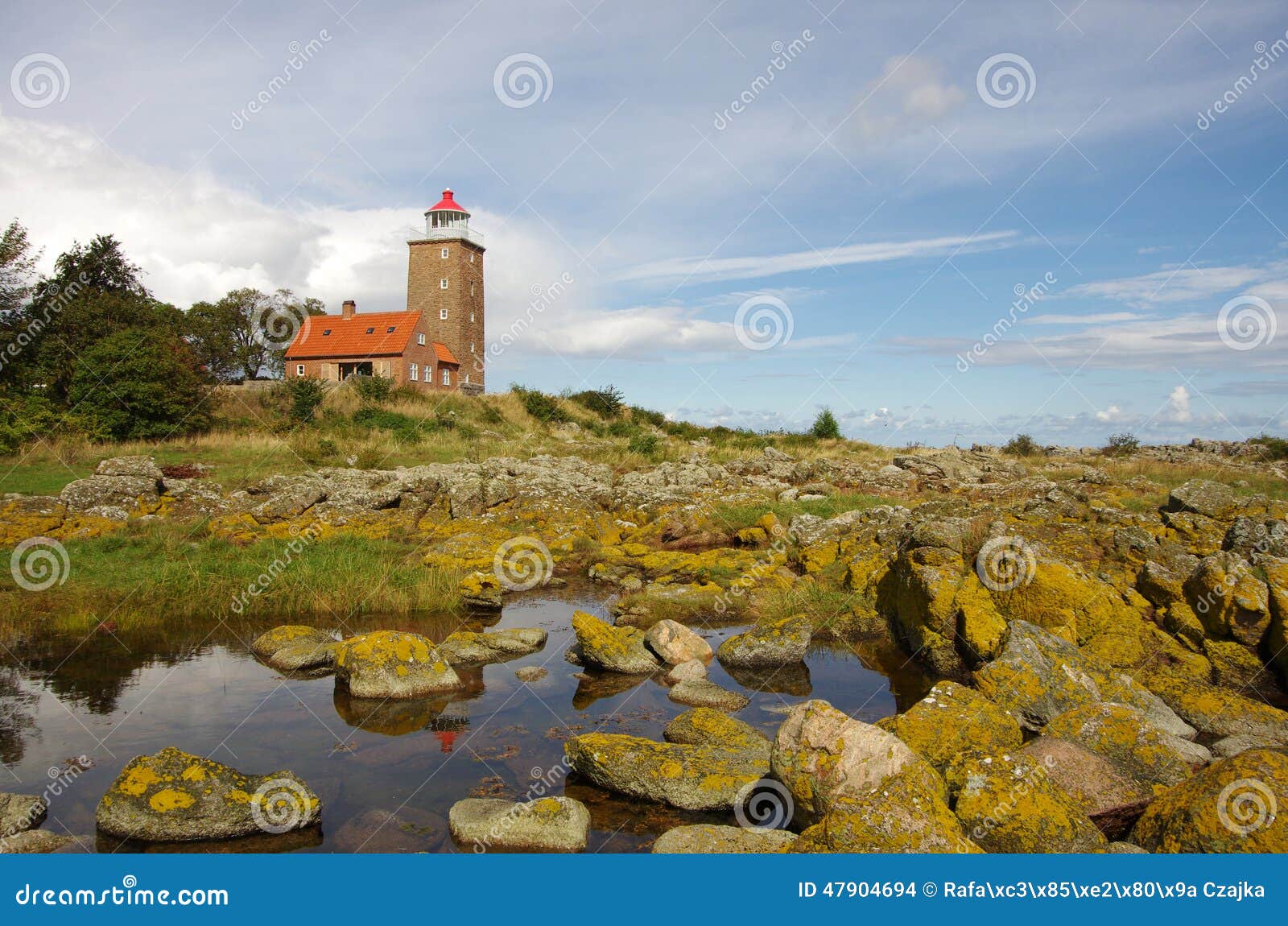 Lighthouse in Svaneke. stock photo. Image of tourism - 47904694