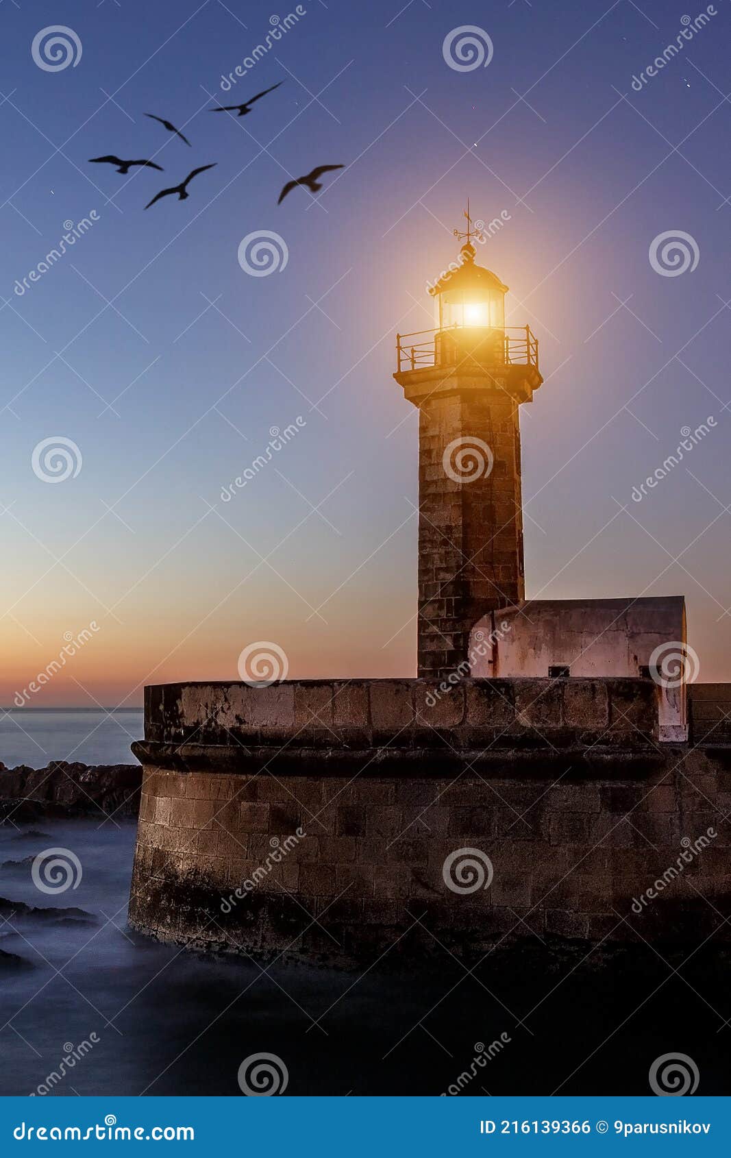 The Lighthouse with Turned Light and Flying Birds Around.. Stock Photo ...