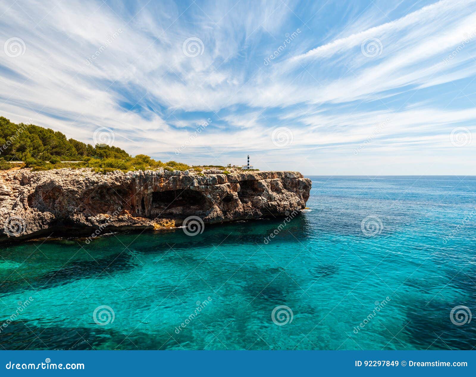Lighthouse on Turquoise Sea Stock Image - Image of waters, lighthouse ...