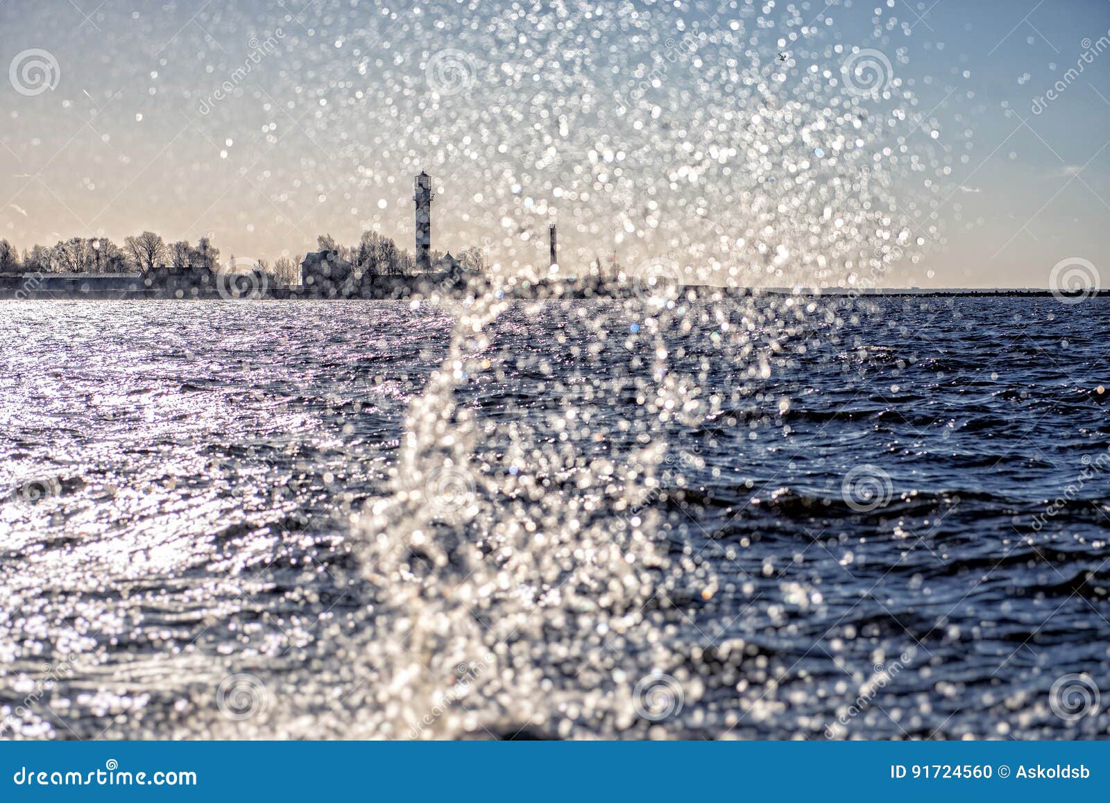 Lighthouse and Wave Splashes on a Sunny Day. Stock Photo - Image of ...