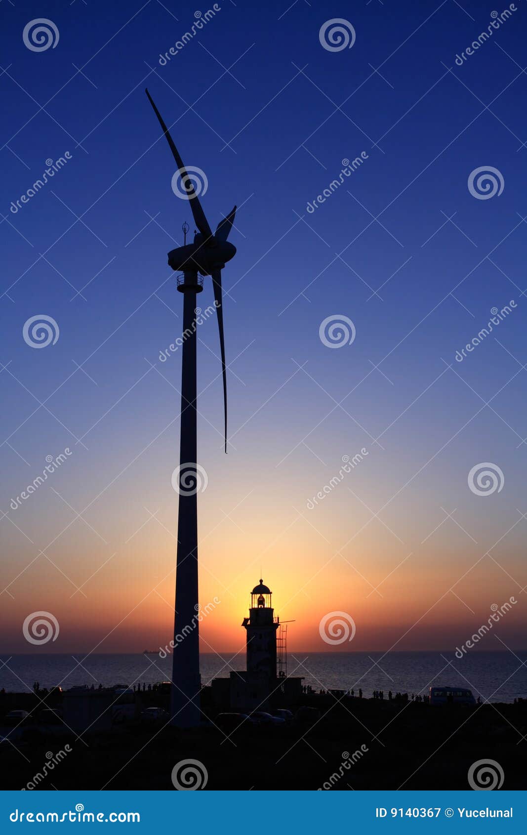 A Lighthouse, a Wind Turbine and a Sunset Stock Image - Image of coast ...