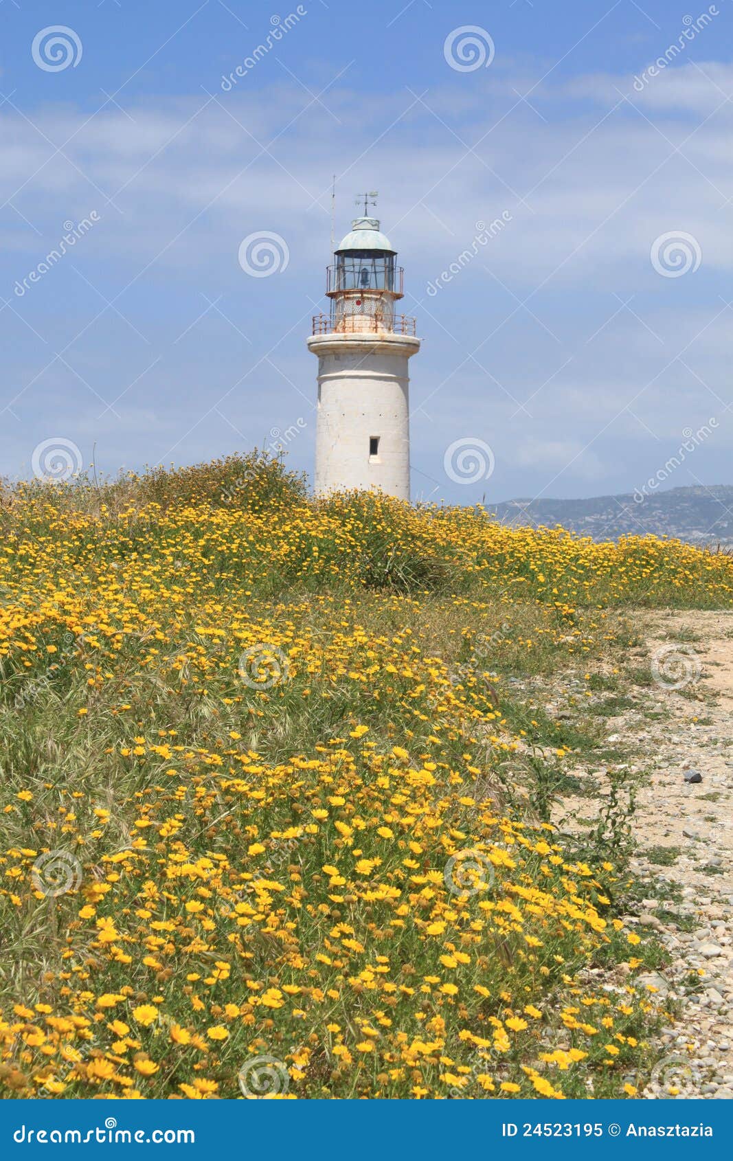 Lighthouse and Yellow Flowers Stock Image - Image of clouds, mountain ...