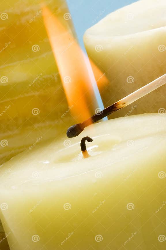 Lighting candle with match stock image. Image of orange - 2004565
